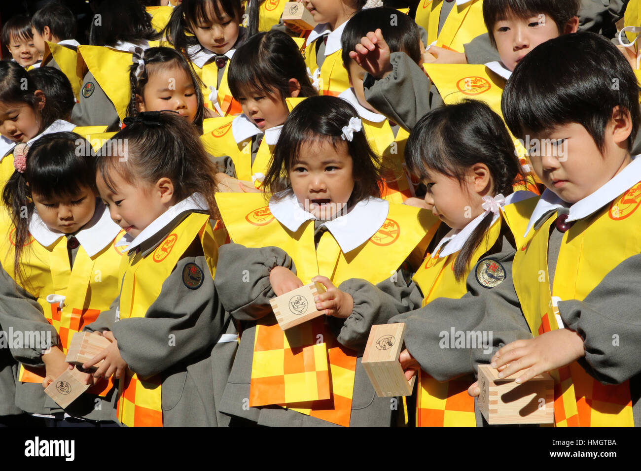 Tokyo, Japan. 3rd Feb, 2017. Kindergarten children throw beans to drive ...