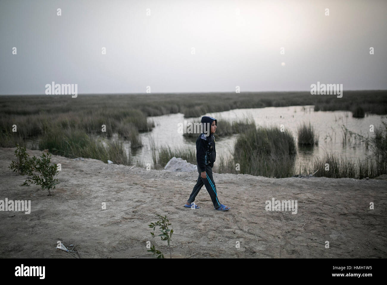 Khouzestan, Iran. 2nd Feb, 2017. An Iranian boy walks at Shadegan ...