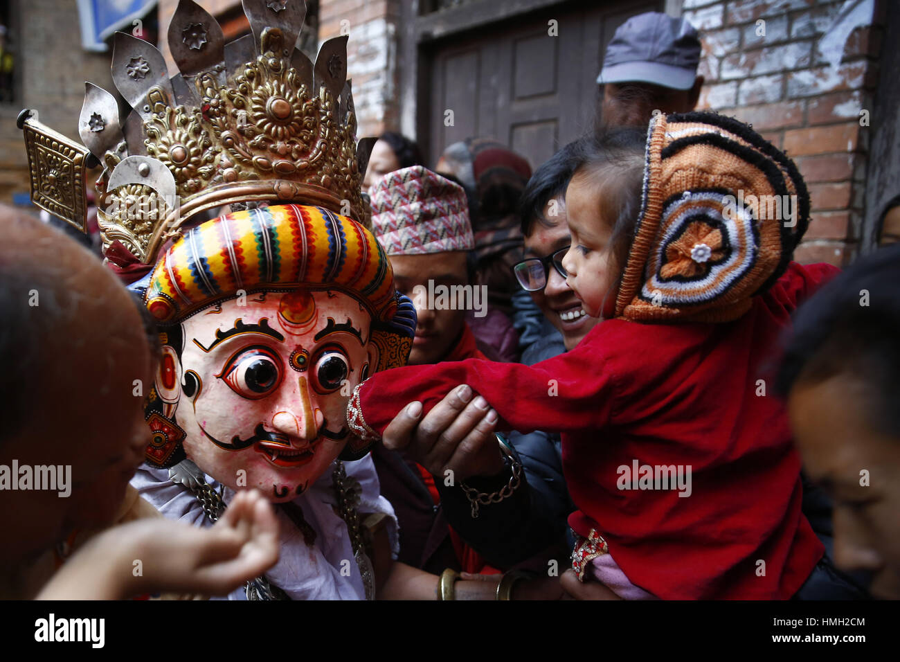 Bhaktapur, Nepal. 3rd Feb, 2017. A Nepalese child reaches to offer ...