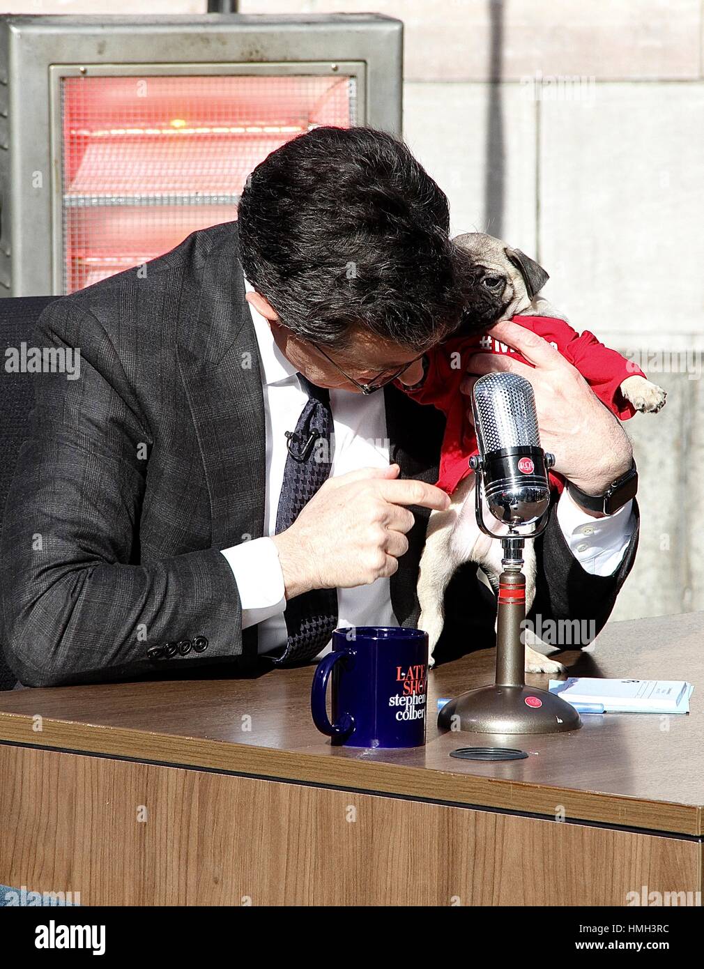 New York, USA. 3rd Feb, 2017. Stephen Colbert plays with a dog wearing ...
