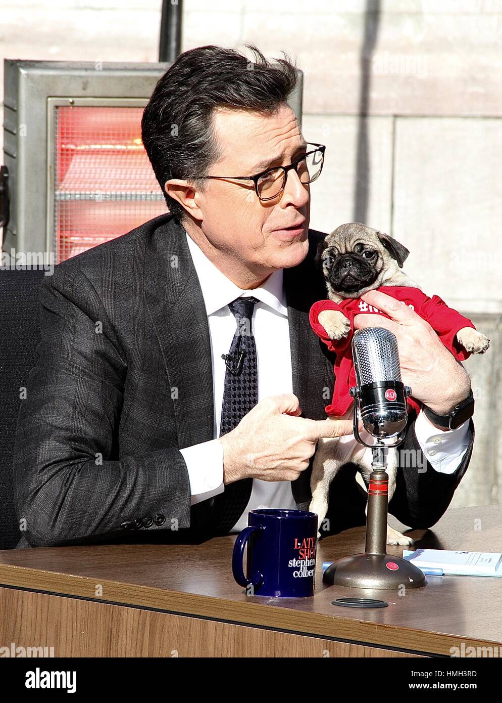 New York, USA. 3rd Feb, 2017. Stephen Colbert plays with a dog wearing ...