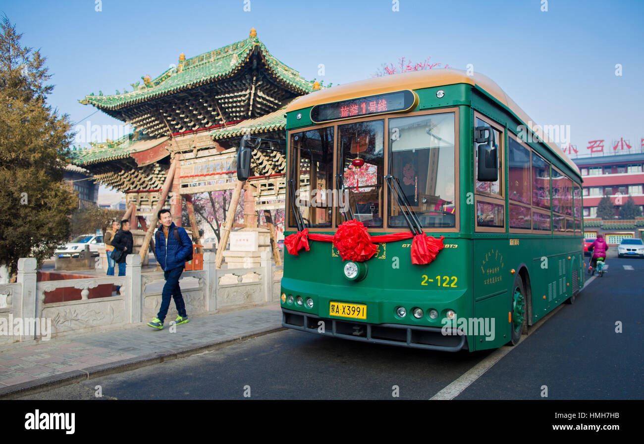 Hohhot. 4th Feb, 2017. A "dangdang" bus runs in Hohhot, capital of ...