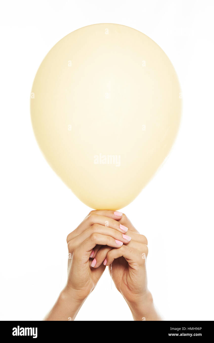 woman hands hold yellow balloon isolated on white Stock Photo - Alamy