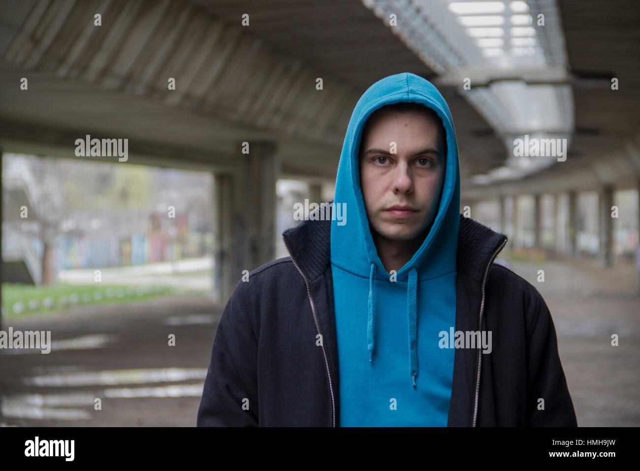 Young Man With A Blue Hood Stock Photo - Alamy