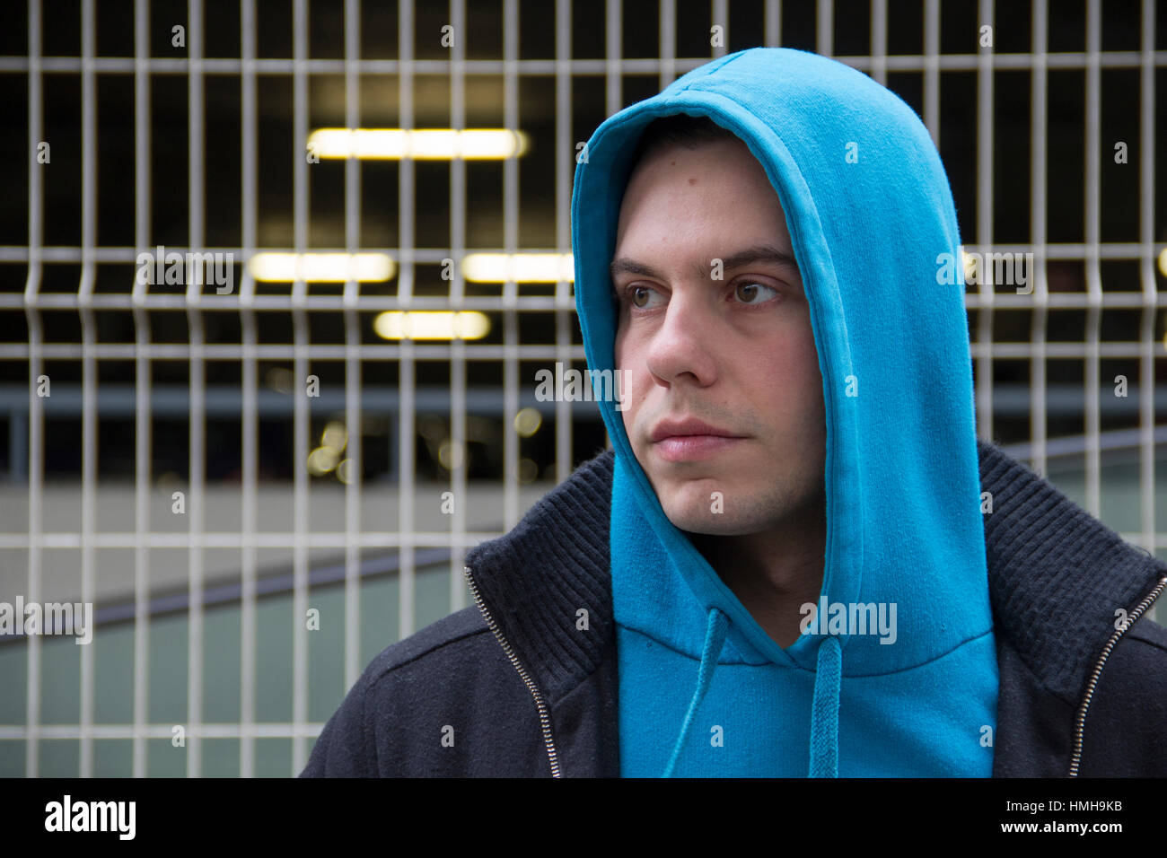 Young Man With A Blue Hood Stock Photo - Alamy