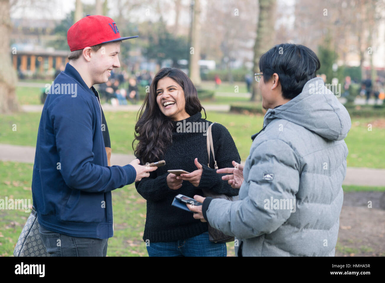 foreign students relaxing in london at a cafe and in a park, while ...