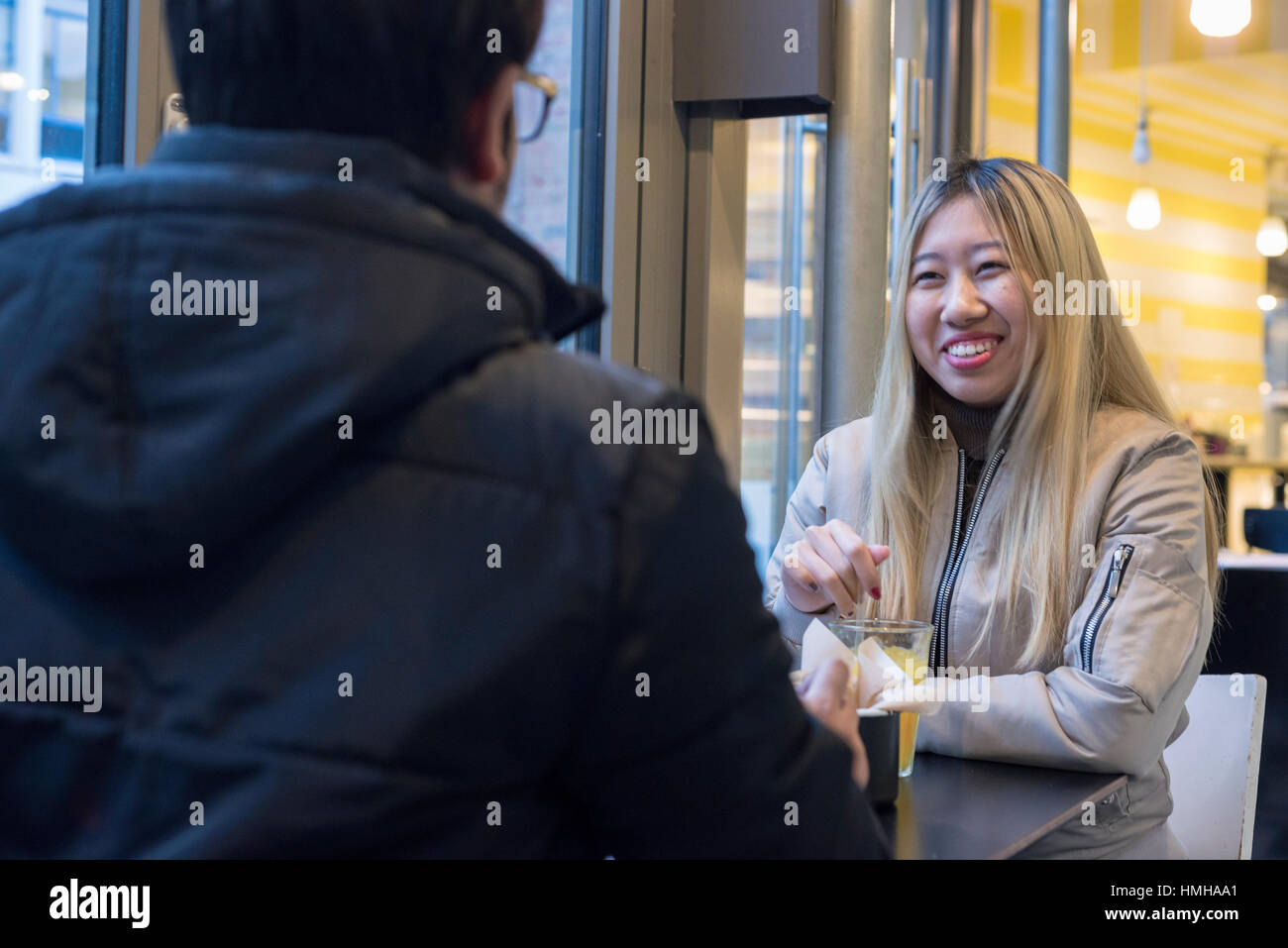foreign students relaxing in london at a cafe and in a park, while ...