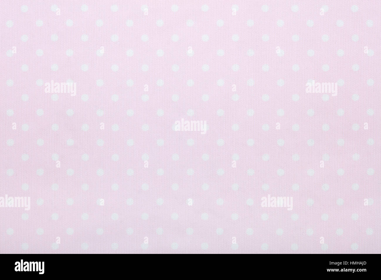 Pink polka dot fabric texture background Stock Photo - Alamy