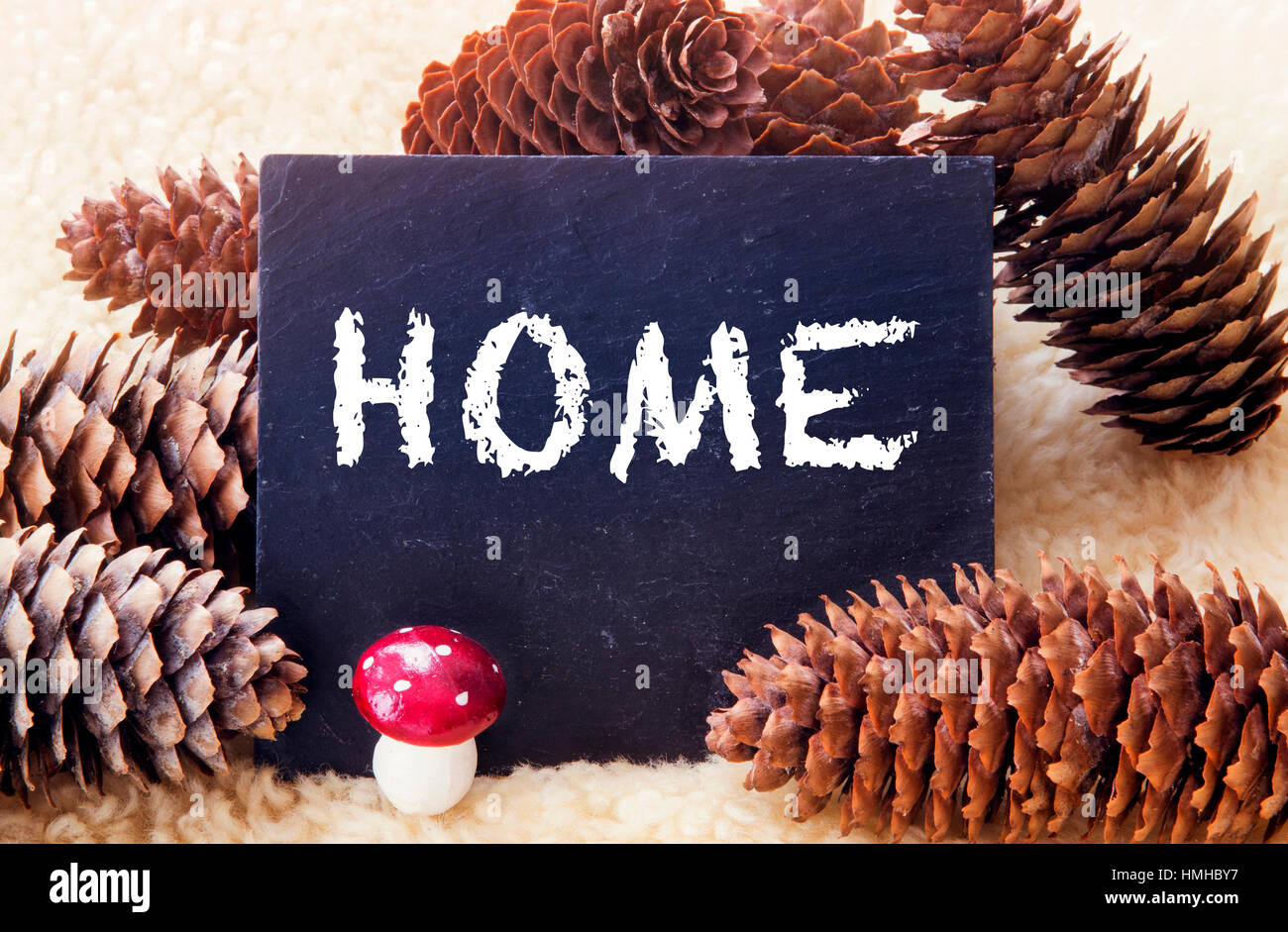 pinecones and chalkboard with the word Home written on it Stock Photo ...