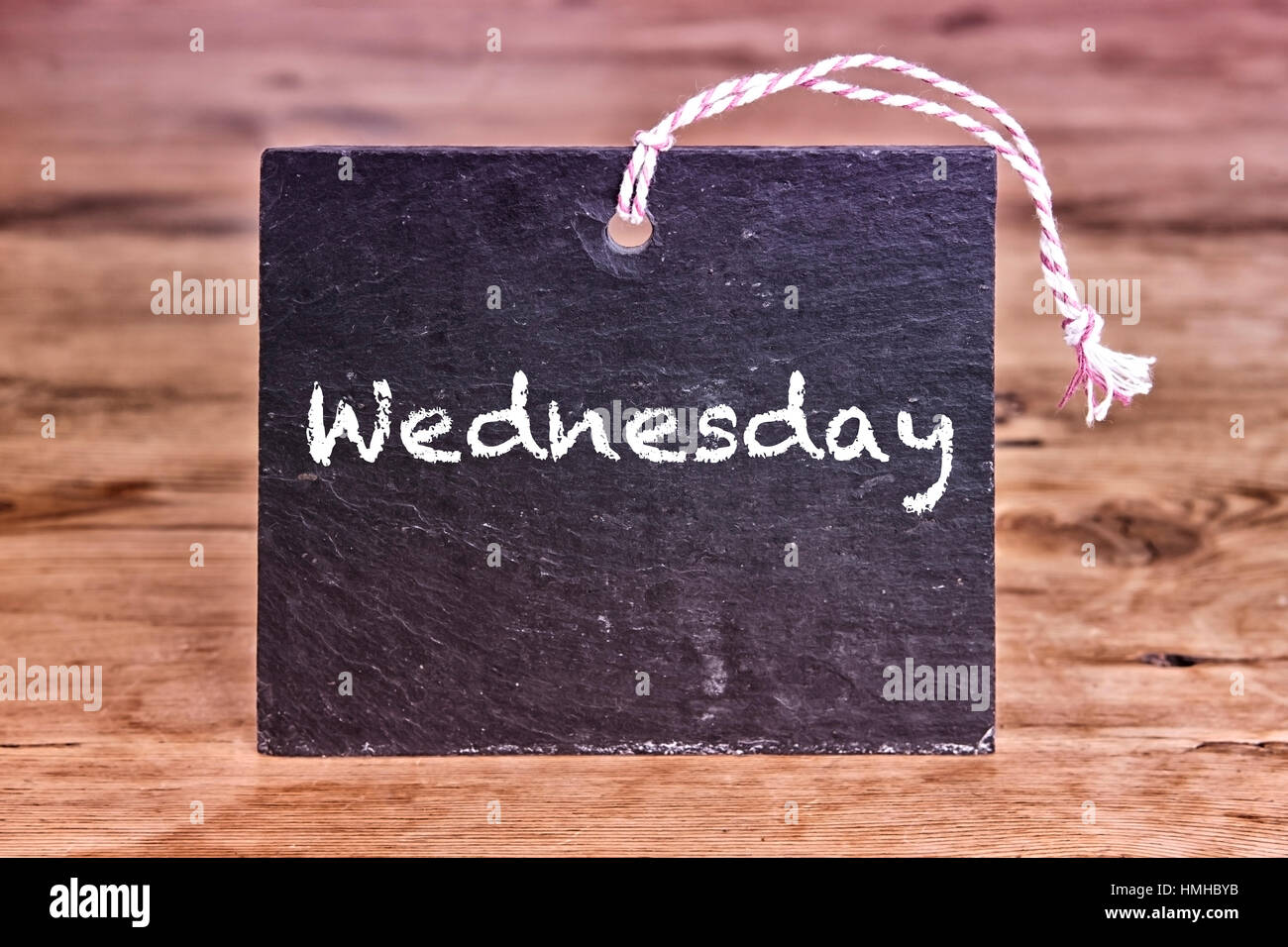 the word Wednesday written on chalk board on wooden table Stock Photo ...