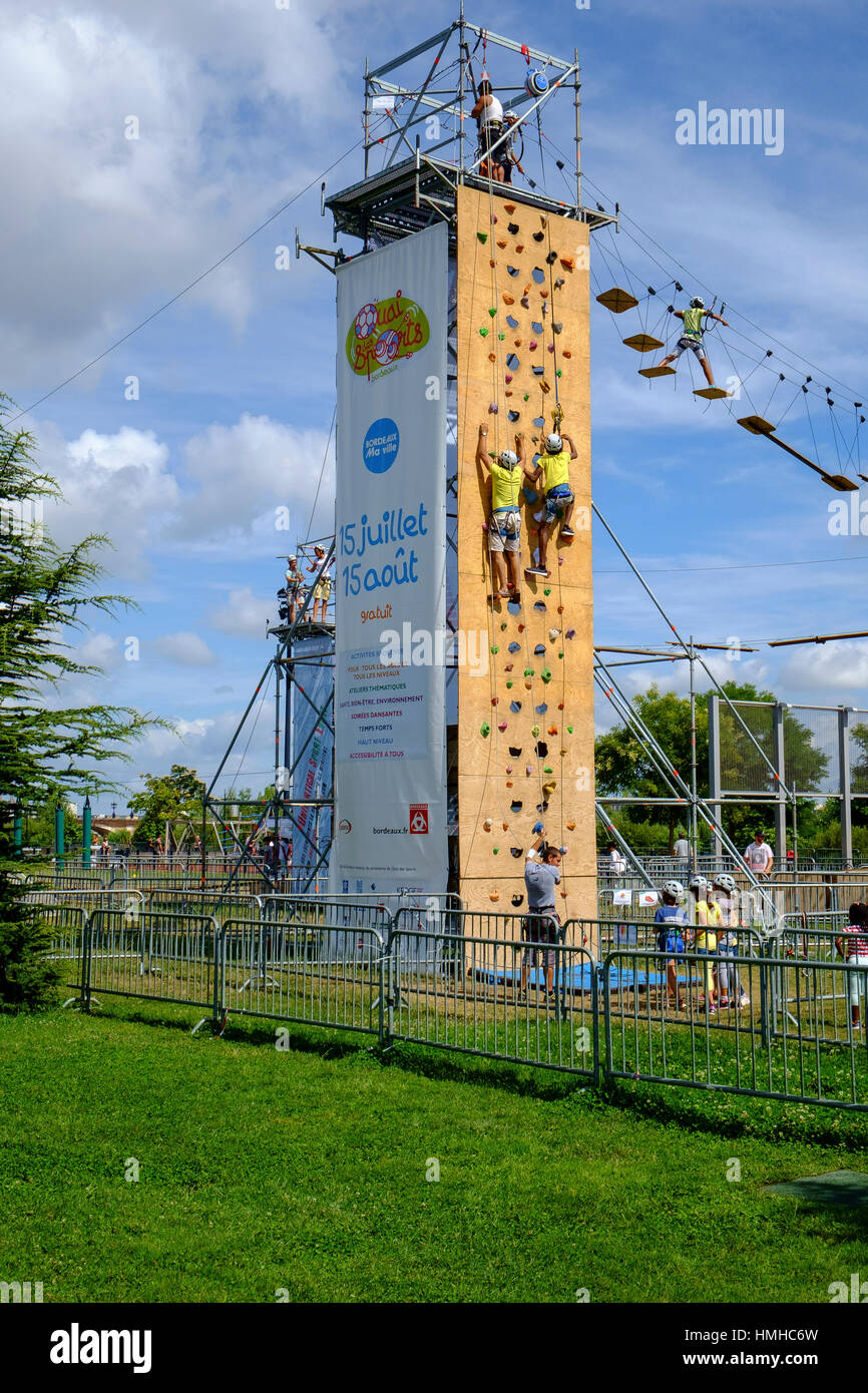 kids climbing wall under supervision Stock Photo - Alamy