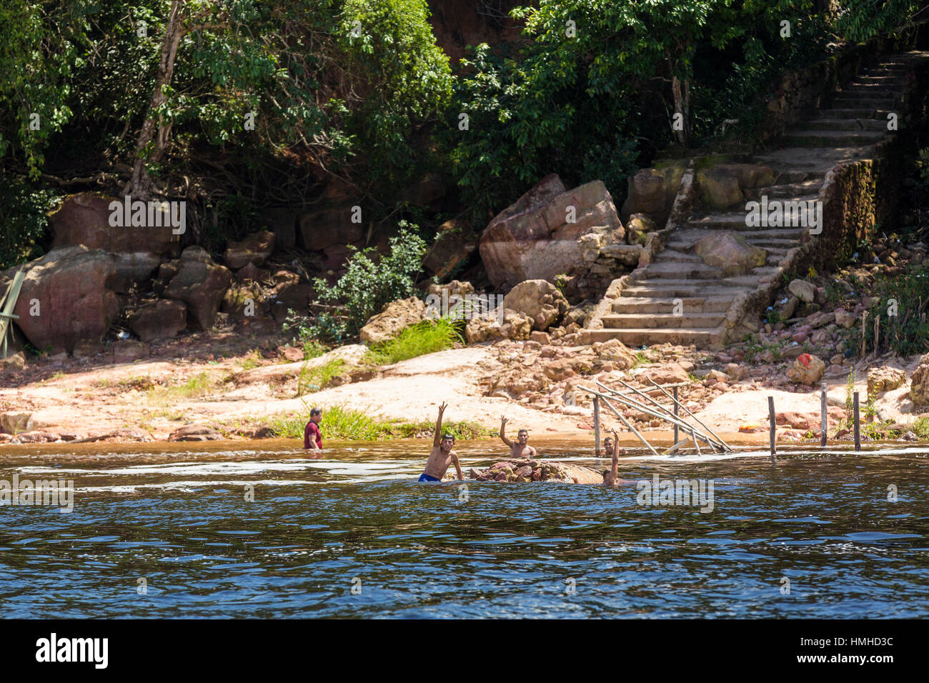 Men swimming in the river near Manaus in the Amazon, Brazil on the Rio ...