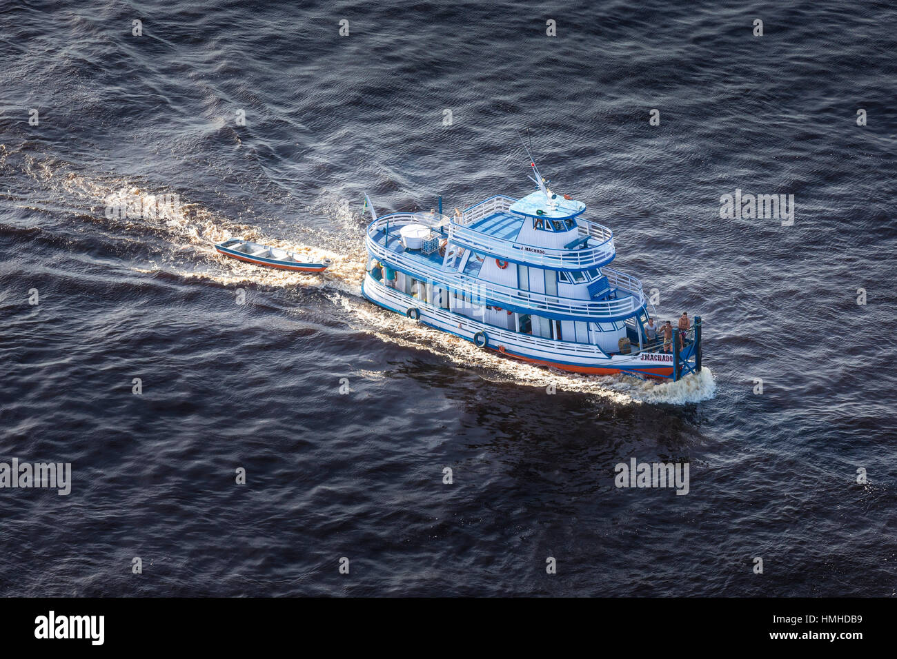 A ferry approaches Manaus in the Amazon, Brazil on the Rio Negro (Black ...