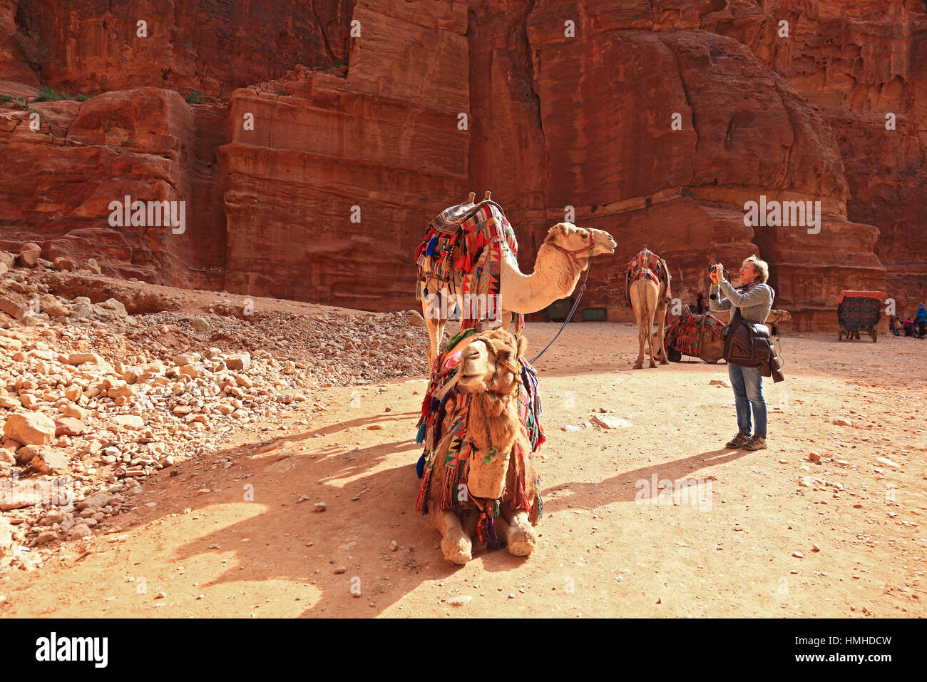 Riding camels, abandoned rock city Petra, al-Batra, capital of the ...