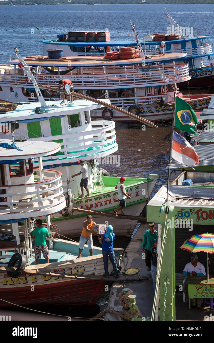 Ferries are loaded in the harbour in Manaus in the Amazon, Brazil on ...