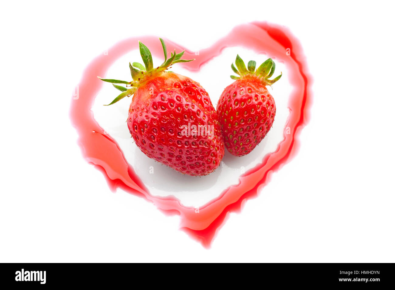 closeup studio photo of two strawberries inside shinny heart from ...