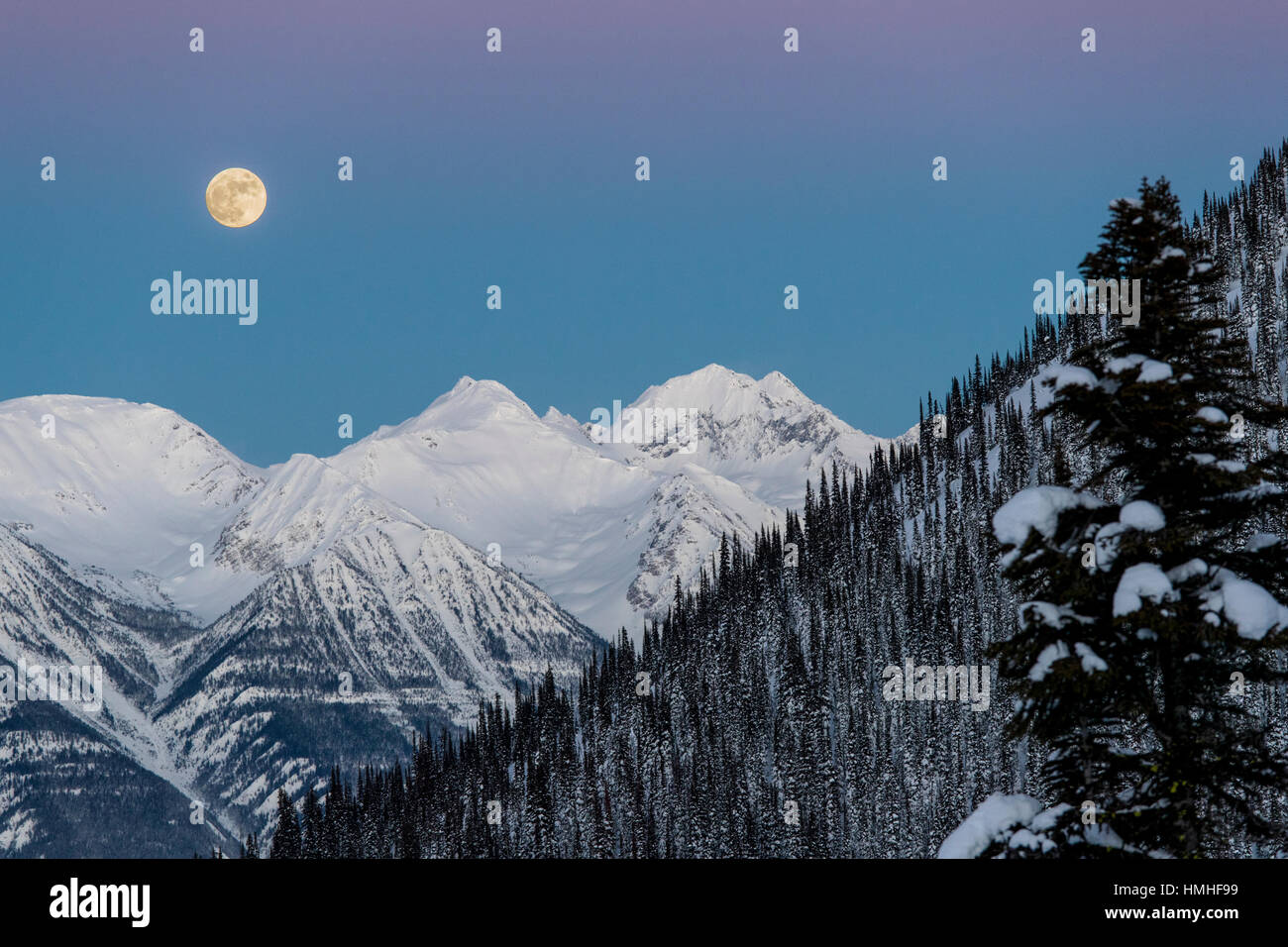 Full moon rising over Canadian Rockies; viewed from Esplanada Range ...