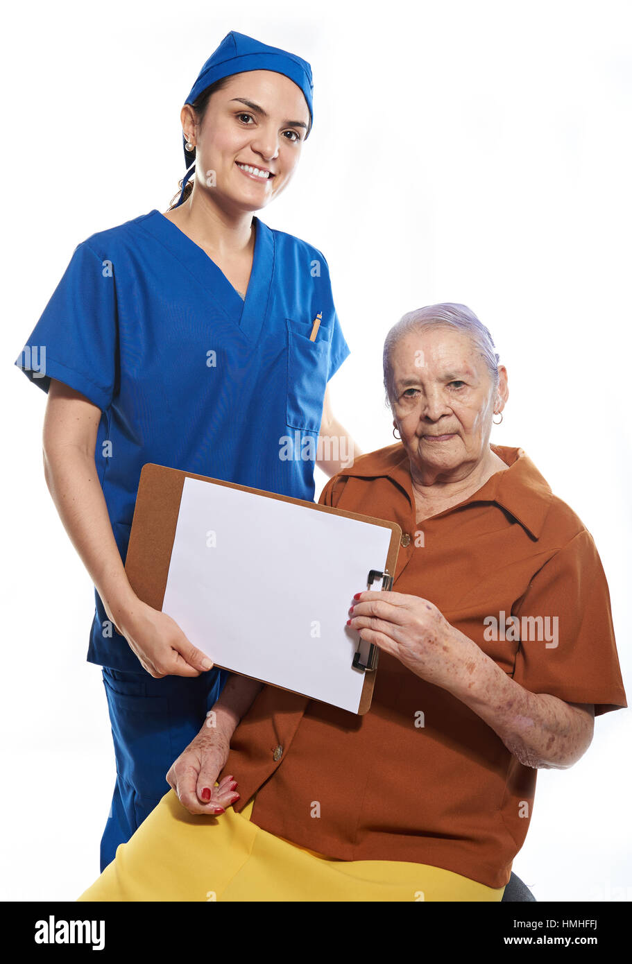 doctor and old woman hold clip board isolated on white Stock Photo - Alamy