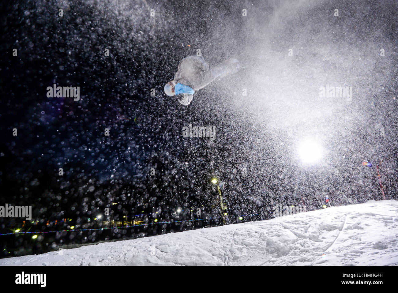 Snowboarder jumping at night Stock Photo - Alamy