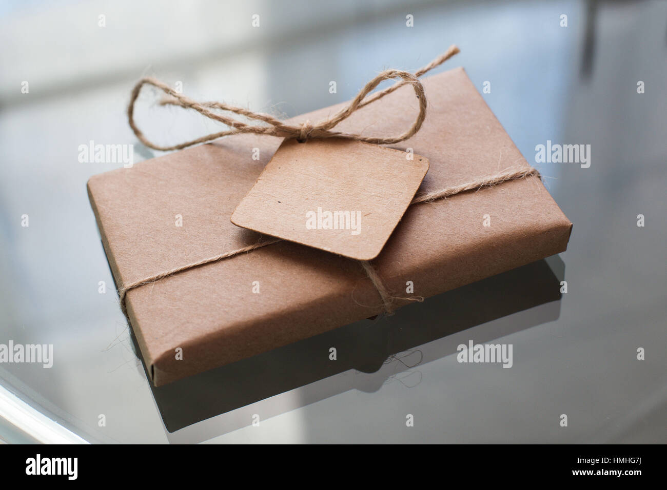 gift in a cardboard box with a label for the label Stock Photo - Alamy