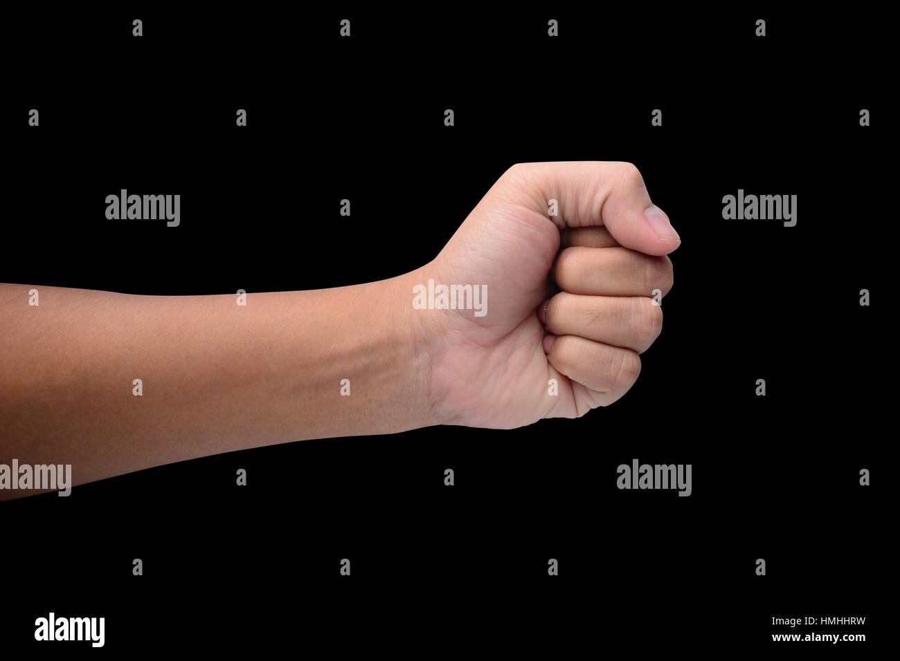 A hand clutched in his fist isolated on black with clipping path Stock ...