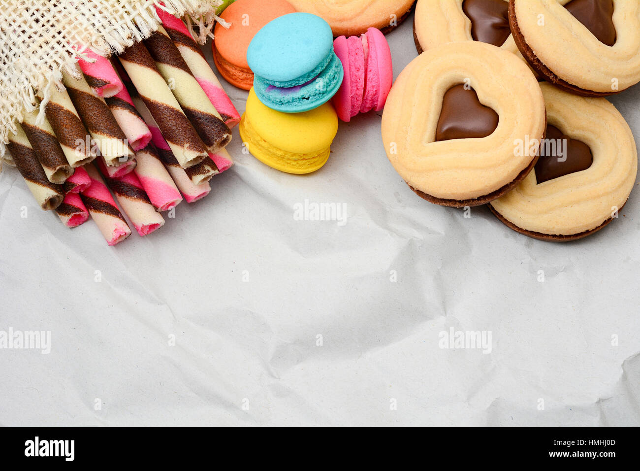 different colorful sweets dessert on paper background Stock Photo - Alamy