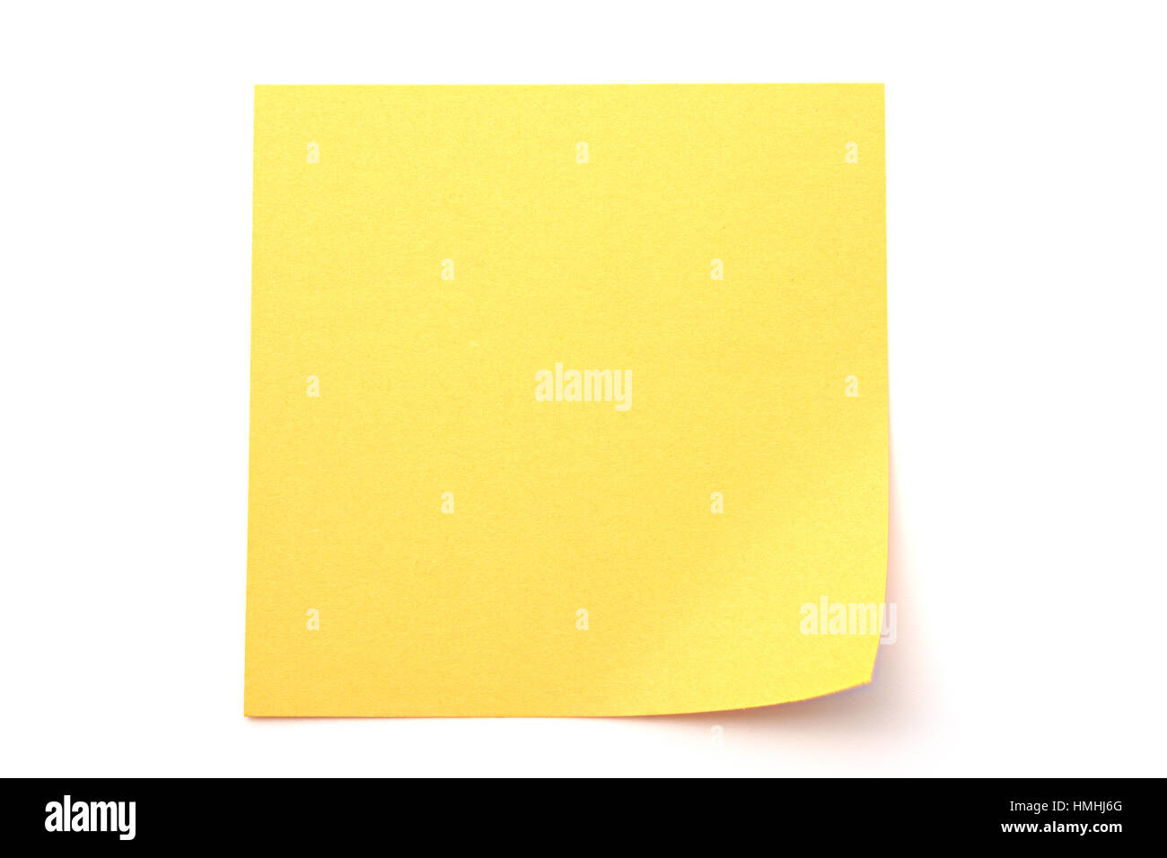 Yellow paper stick note on a white background Stock Photo - Alamy