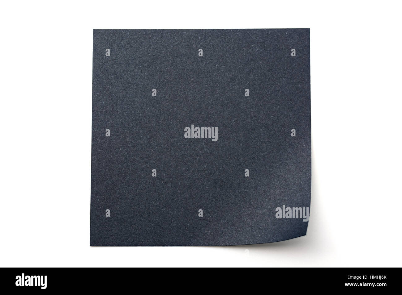 Black paper stick note on a white background Stock Photo - Alamy