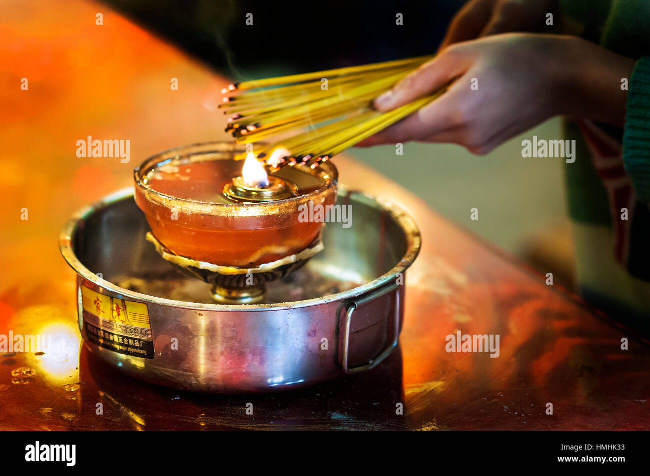 Lighting incense at a Hong Kong temple Stock Photo - Alamy