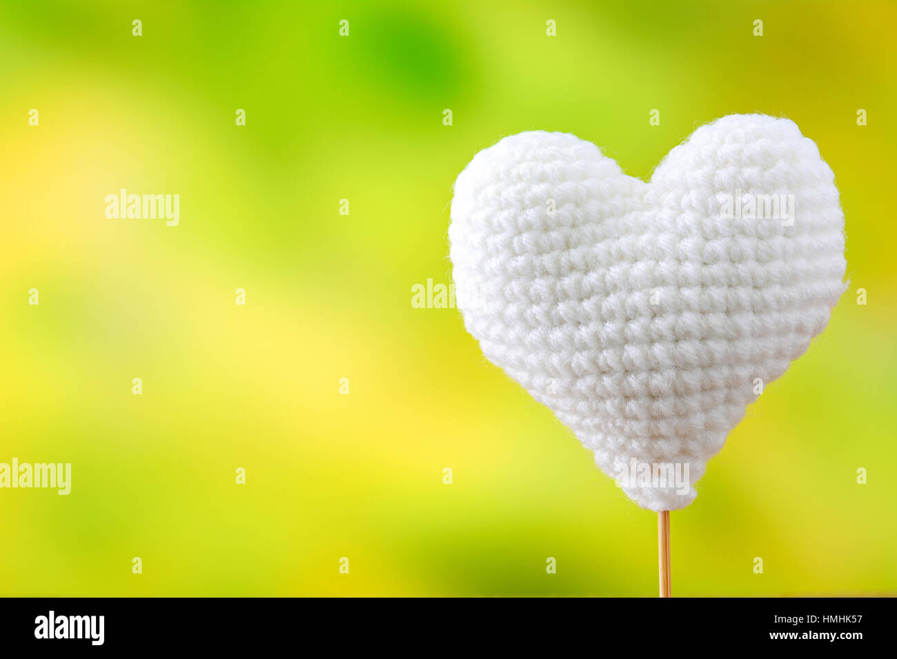 White heart make from yarn on nature background Stock Photo - Alamy