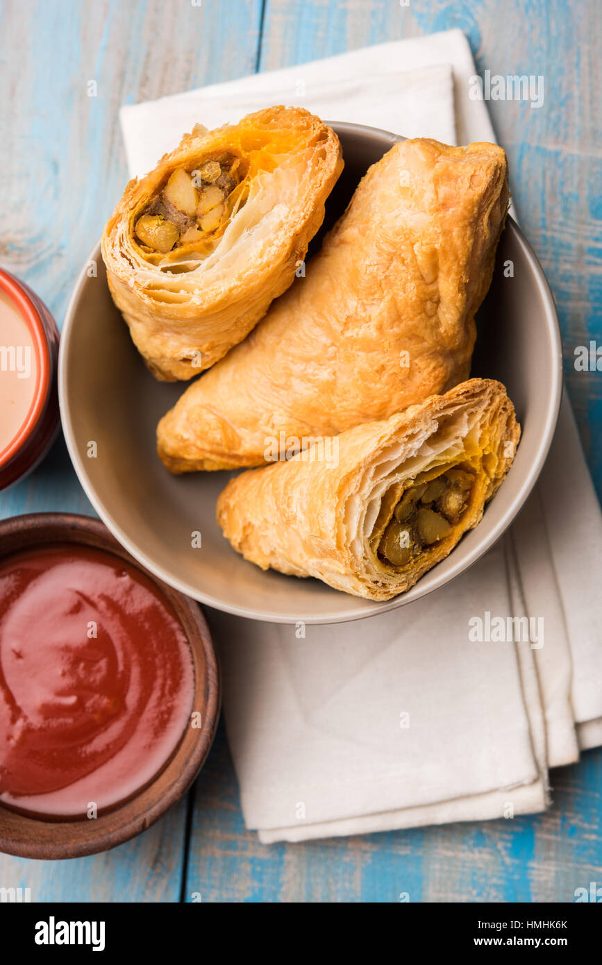 Save Download Preview stuffed vegetable or veg puff or puf or samosa ...