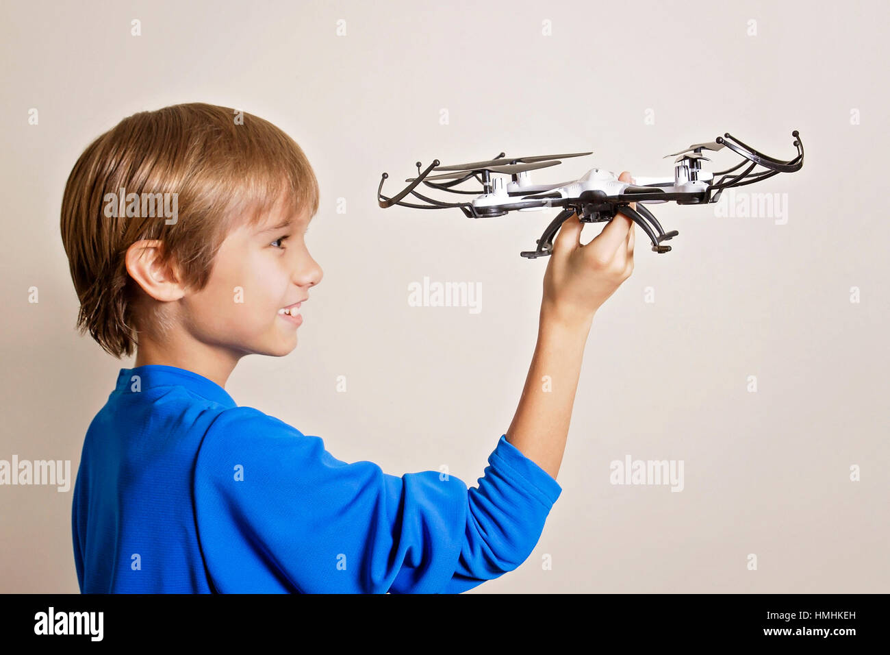 Little kid playing with drone Stock Photo - Alamy