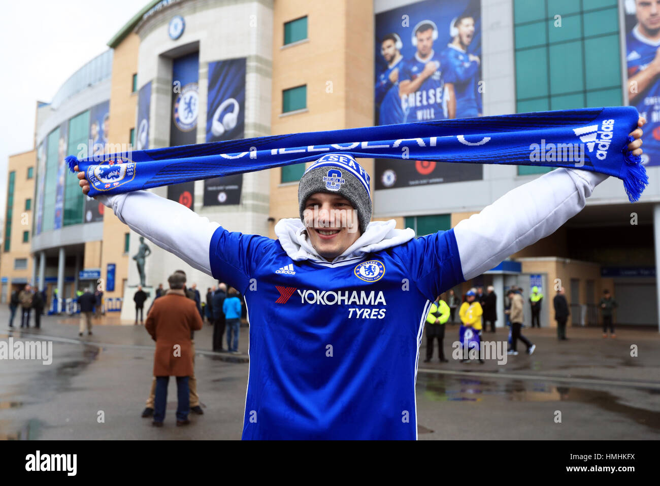 A Chelsea fan holds up a scarf outside Stamford Bridge before the ...