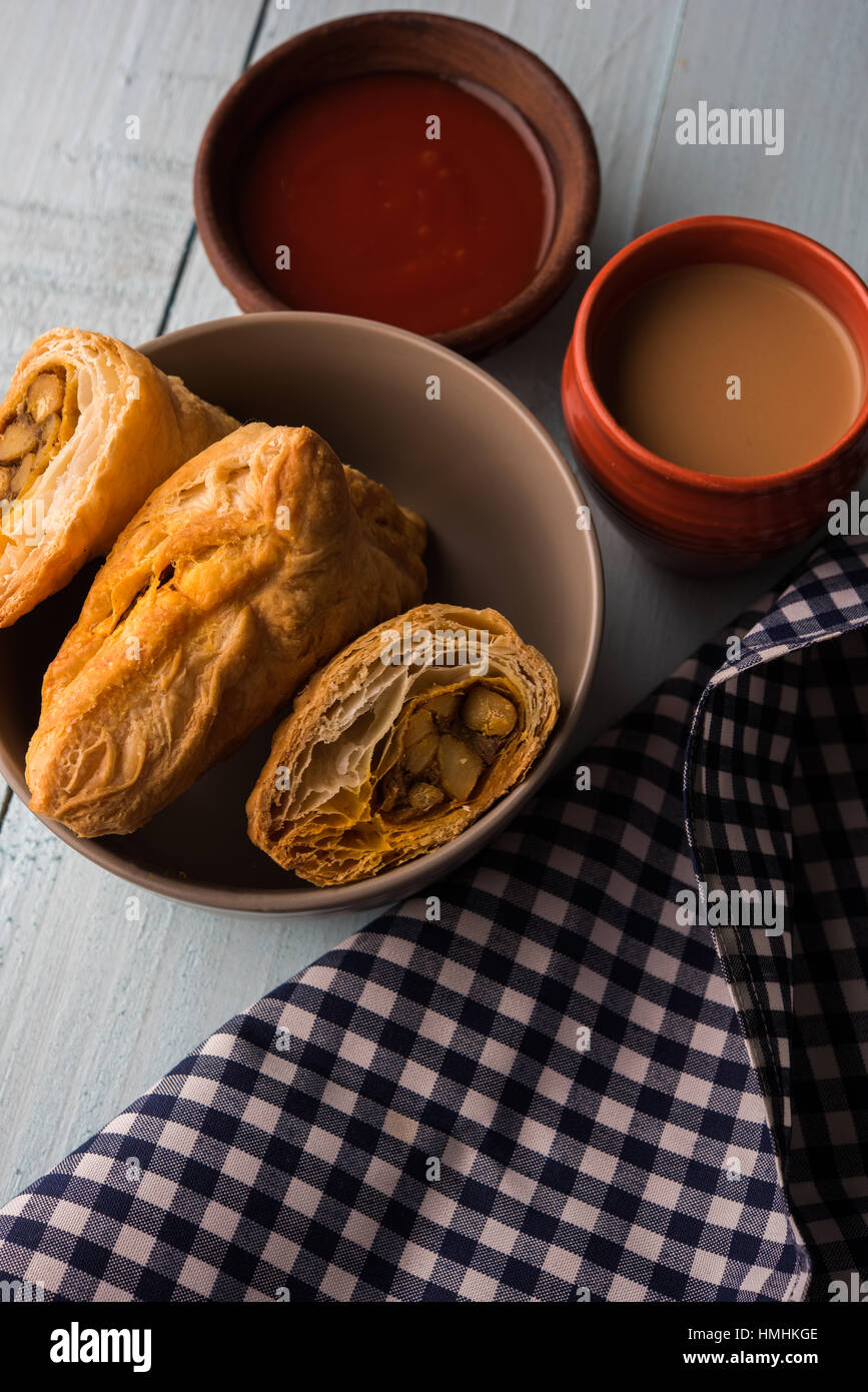 Save Download Preview stuffed vegetable or veg puff or puf or samosa ...