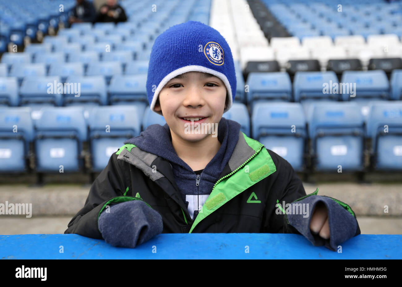 A young Chelsea fan poses for a picture in the stands before the ...