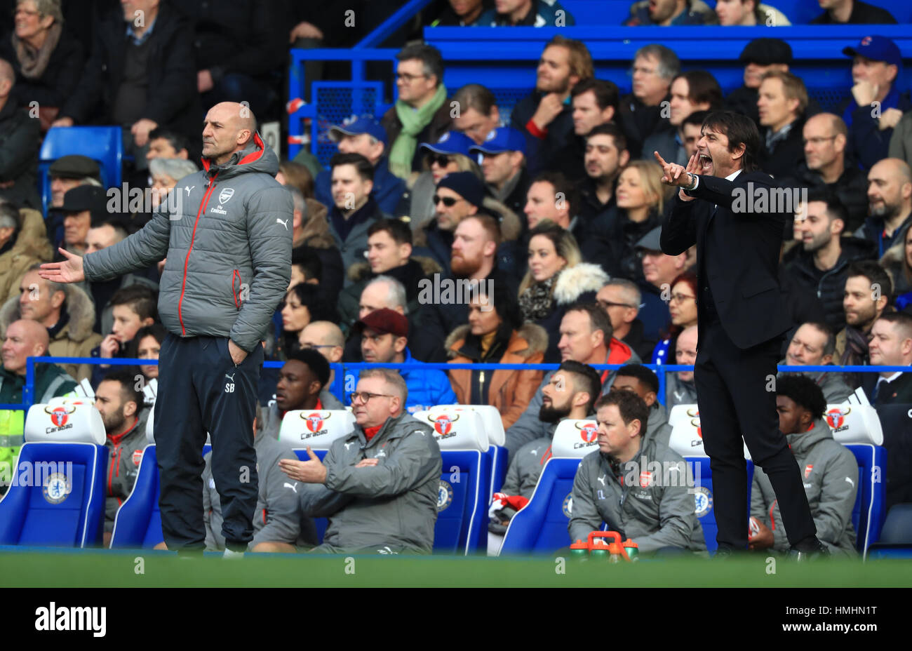 Arsenal assistant manager Steve Bould (left) and Chelsea manager ...
