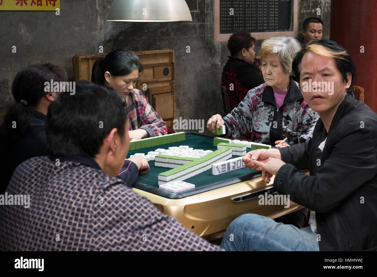 Chinese man playing mahjong hi-res stock photography and images - Alamy