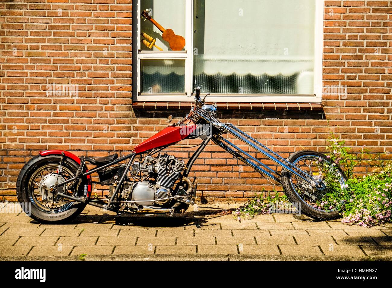 Chopper in front of a window in Zaandam, Holland Stock Photo - Alamy