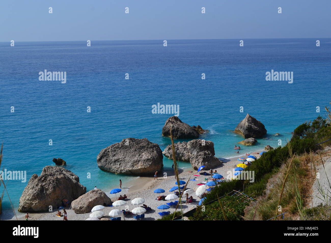 Colorful beach, Lefkas, Greece, sandy beach and big rocks Stock Photo ...