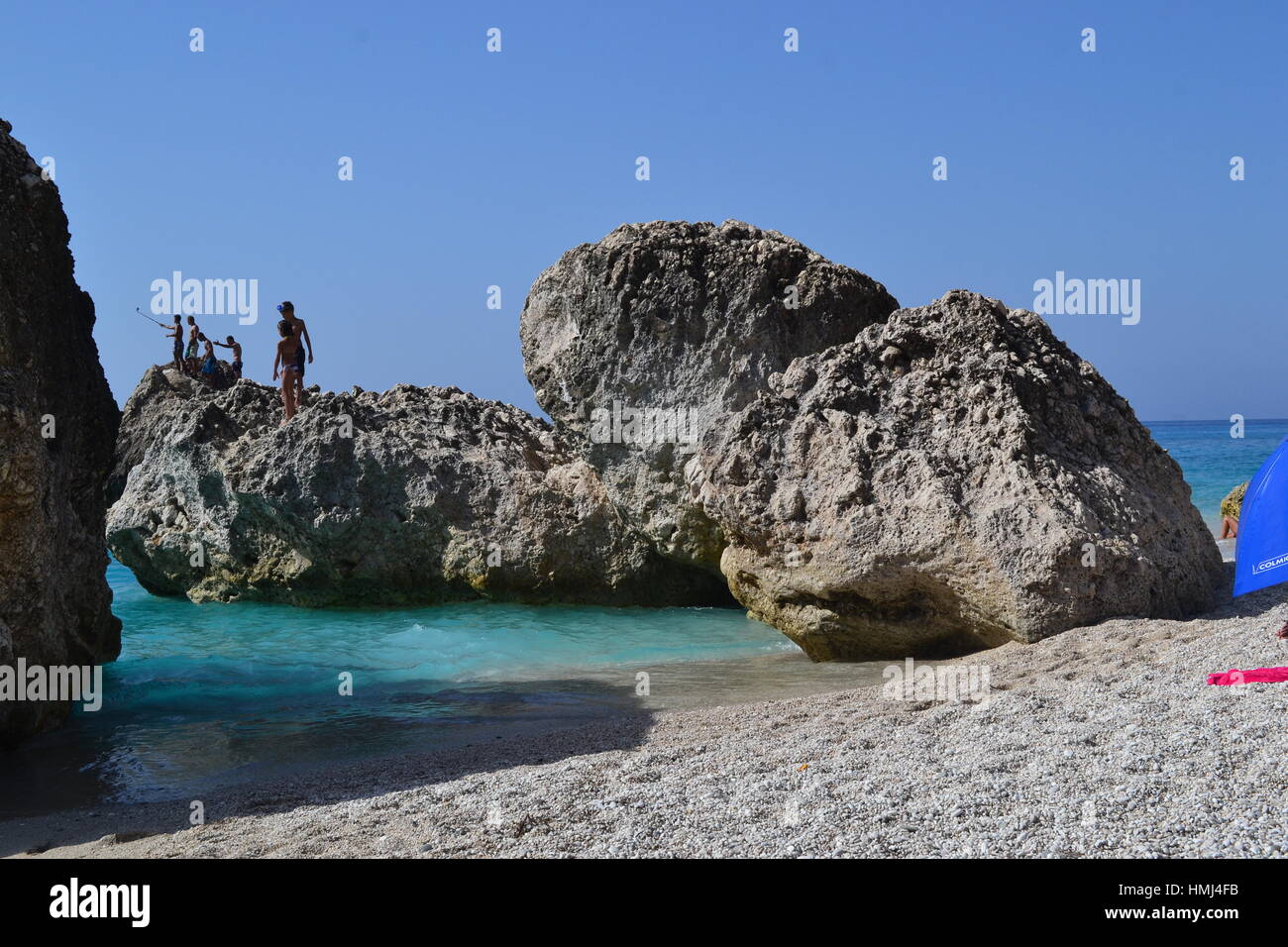 Colorful beach, Lefkas, Greece, sandy beach and big rocks Stock Photo ...