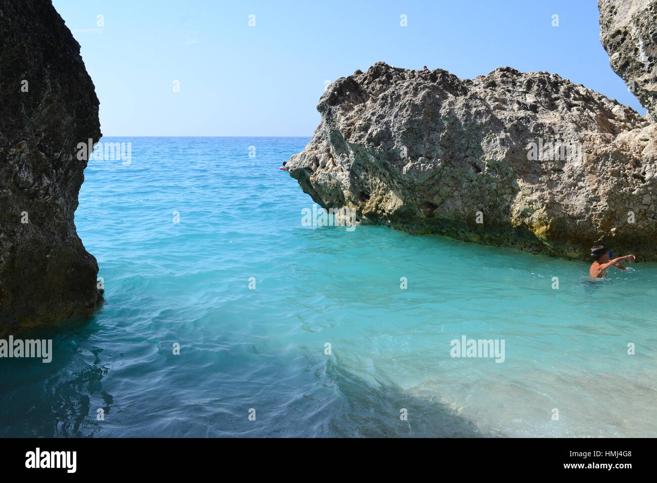 Colorful beach, Lefkas, Greece, sandy beach and big rocks Stock Photo ...