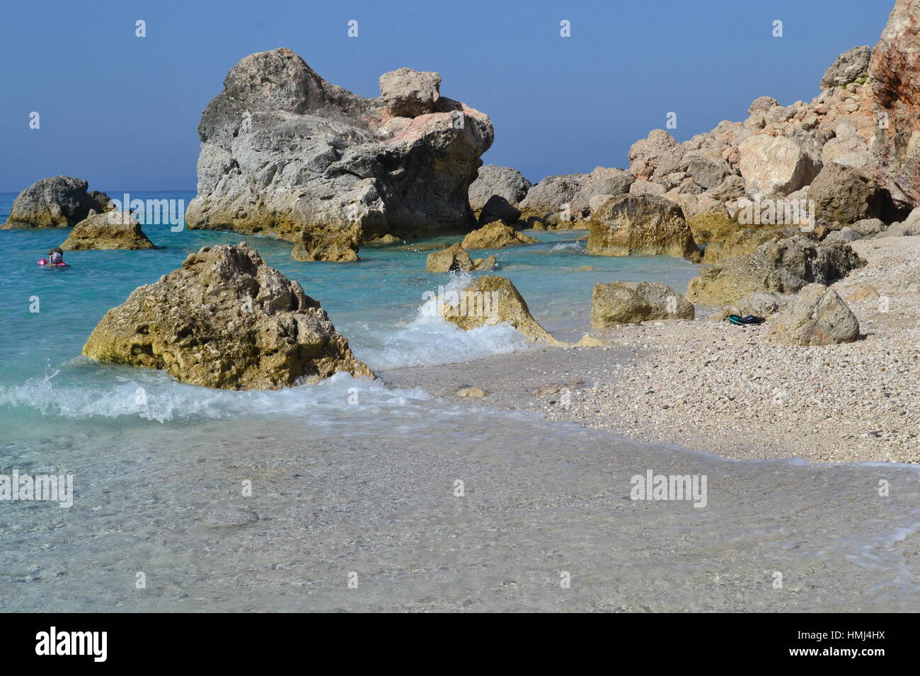 Colorful beach, Lefkas, Greece, sandy beach and big rocks Stock Photo ...
