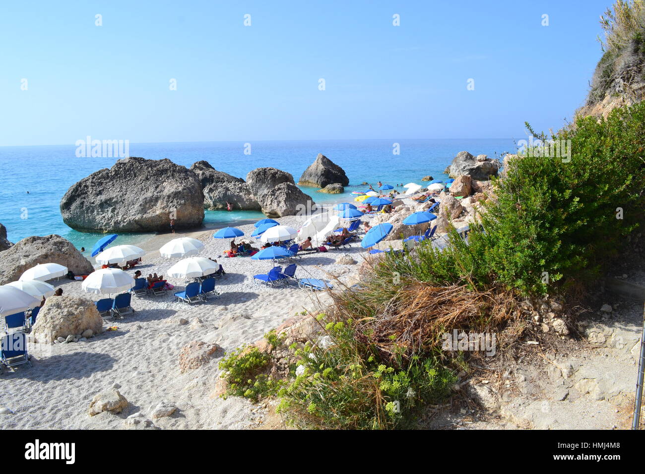 Nice beach on Lefkada island, Greece. Sandy beach, parasols for shade ...
