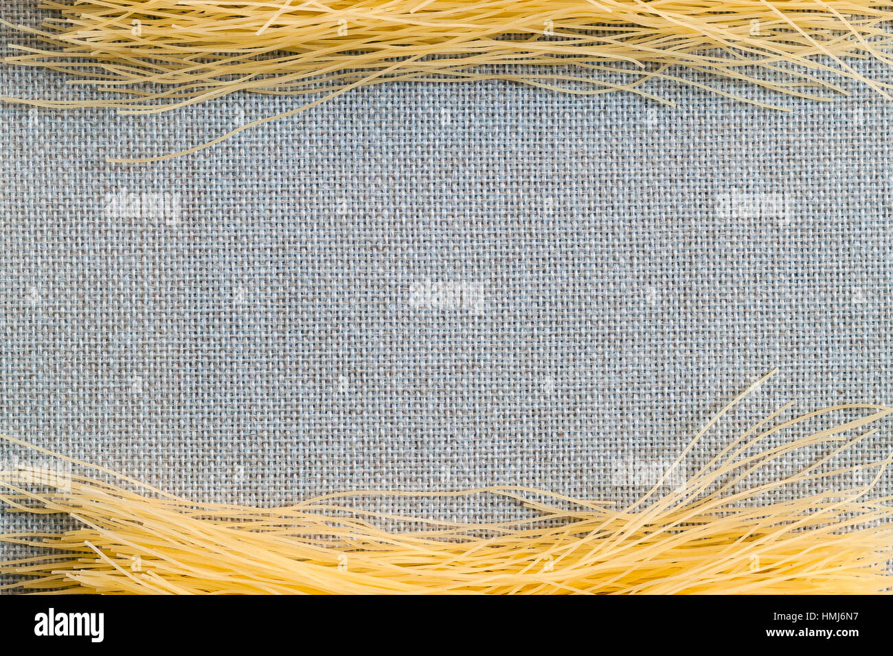 Bavette pasta spaghetti on a burlap cloth with a dark background with ...