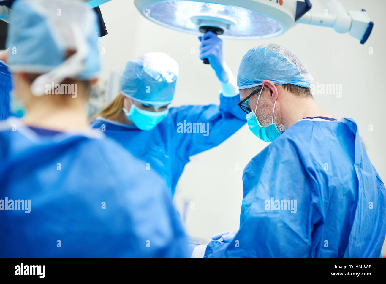 Busy doctors over the operating table Stock Photo - Alamy