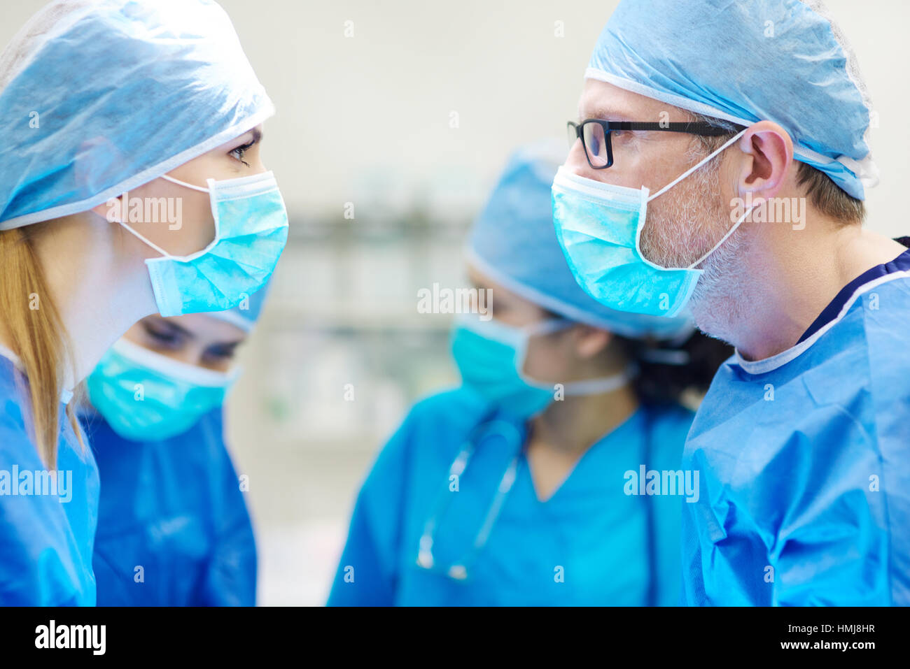 Two surgeons standing face to face Stock Photo - Alamy