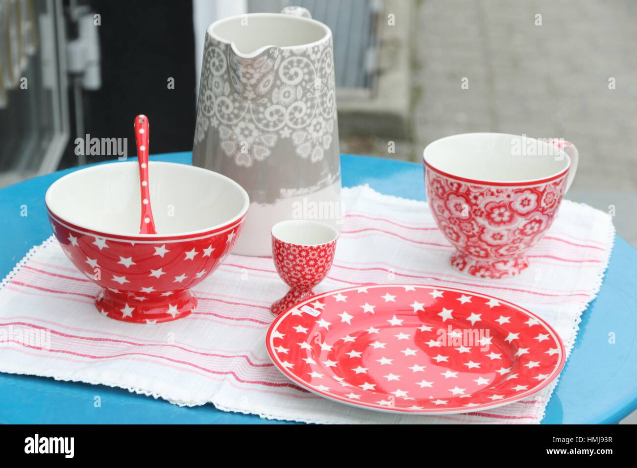 Setting table in red Stock Photo - Alamy