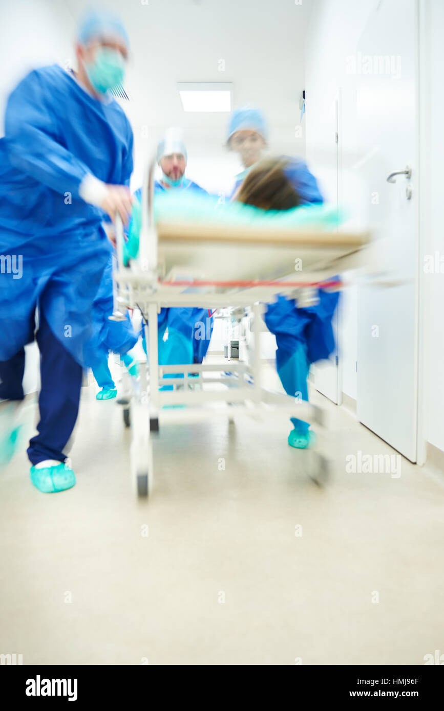Doctors running to the operating room Stock Photo - Alamy
