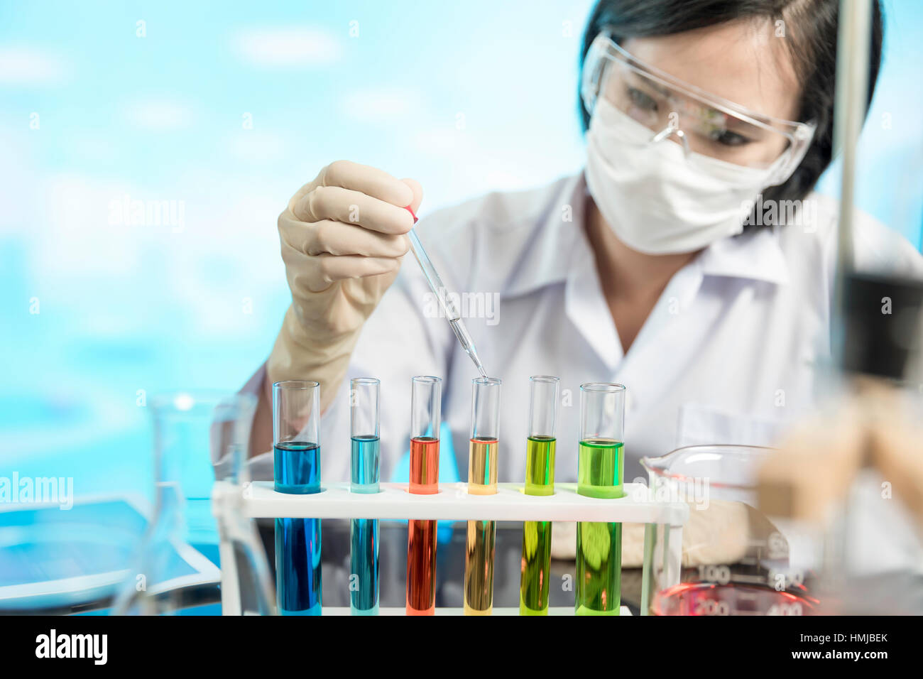 Female scientist researching in laboratory Stock Photo - Alamy