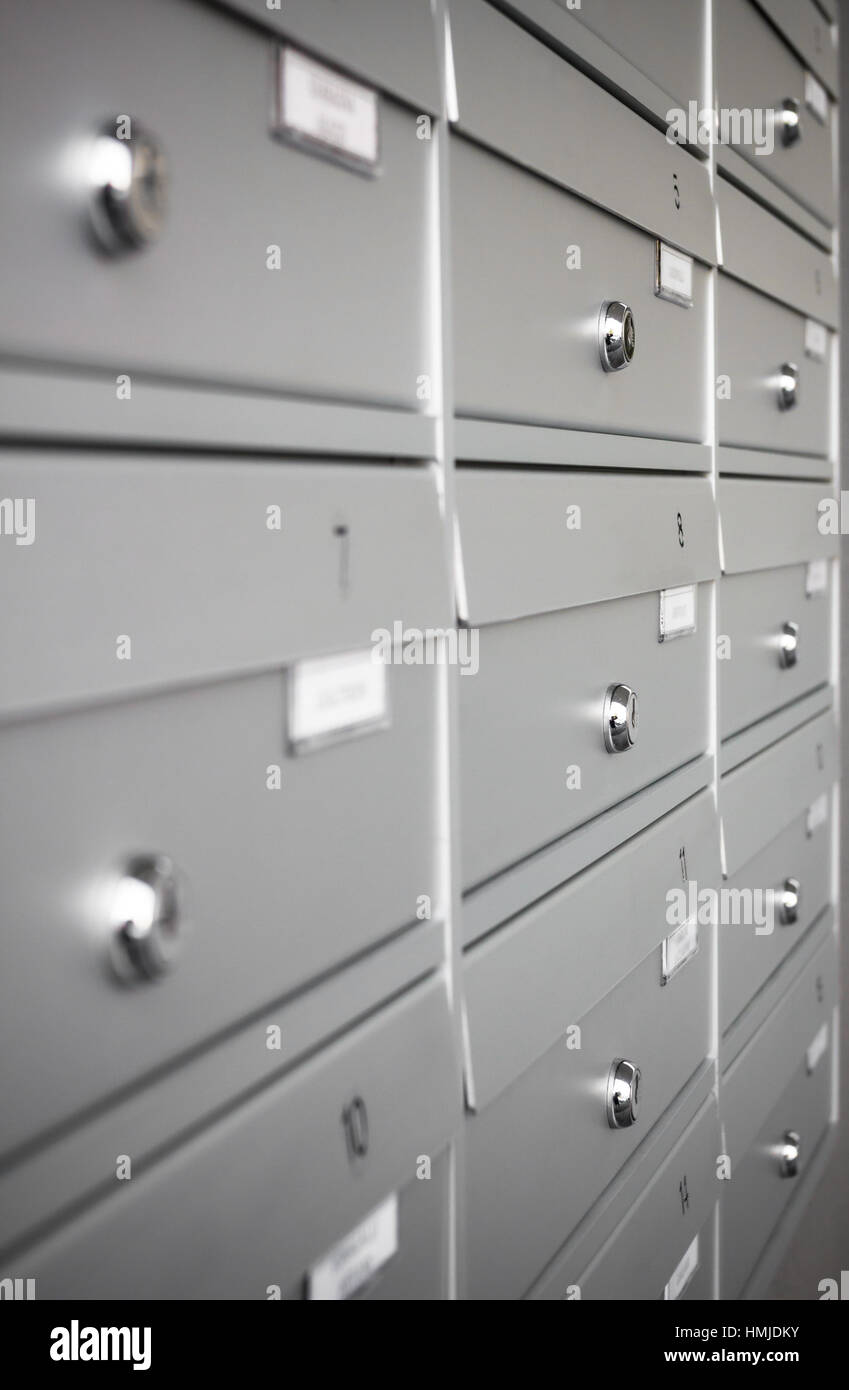 Rows of aluminum mail boxes for concepts such as safety and security ...